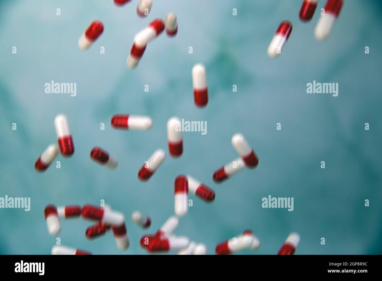 Falling medicine pills defocused blurred background, capsules for ...