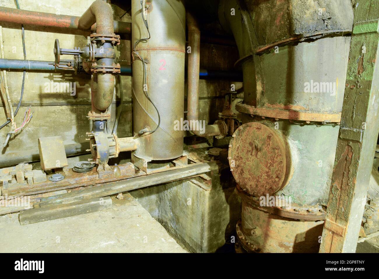 Basement of a water pumping station. Abandoned post-apocalyptic view of ...