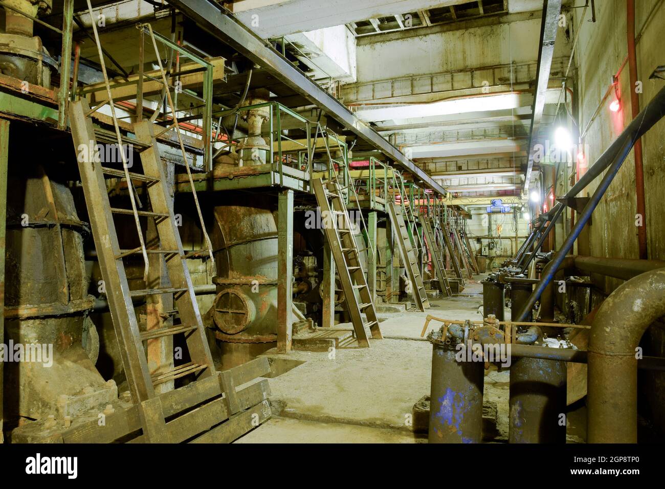 Basement of a water pumping station. Abandoned post-apocalyptic view of ...