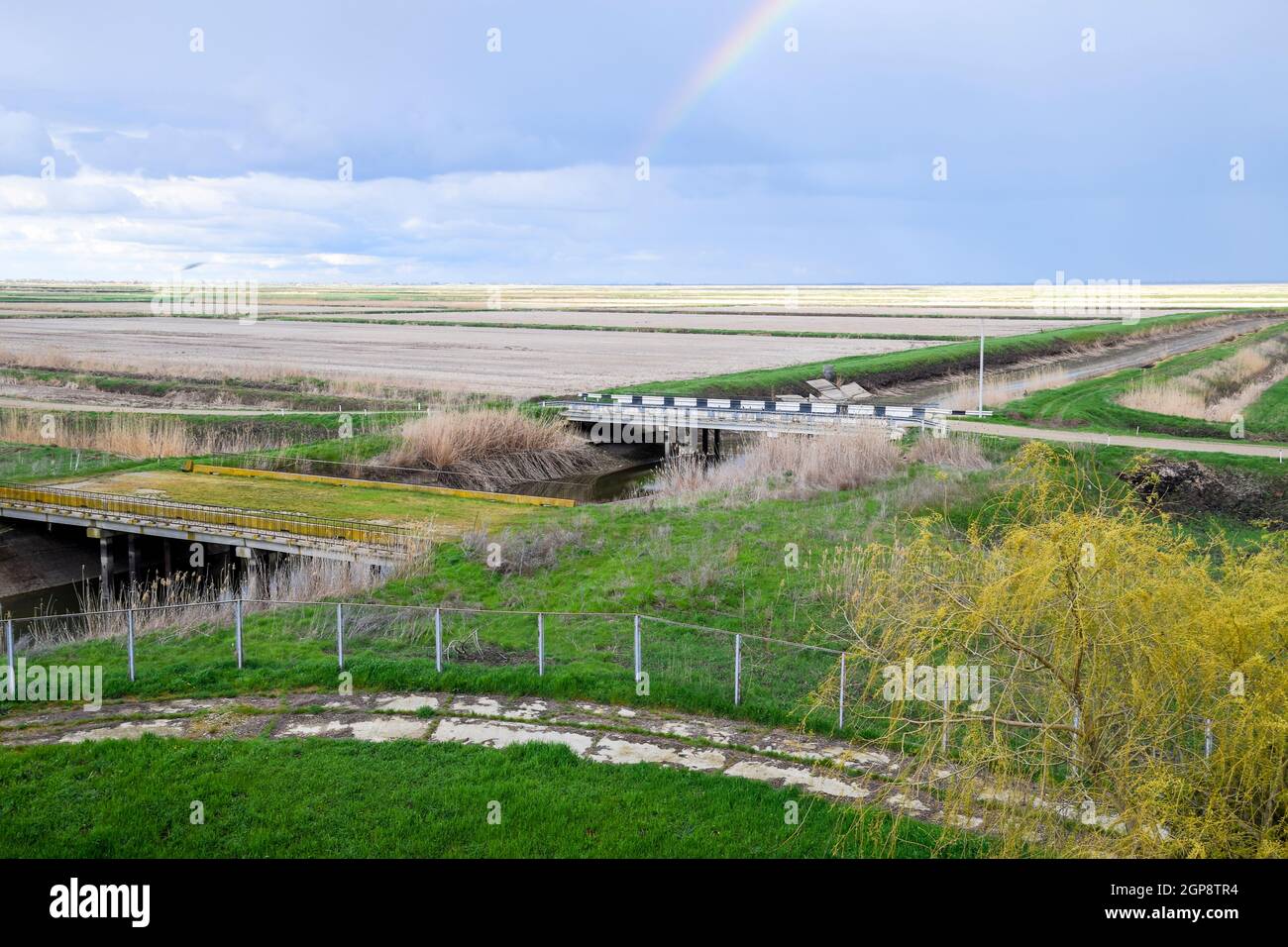 Bridges through irrigation canals. Rice field irrigation system Stock ...