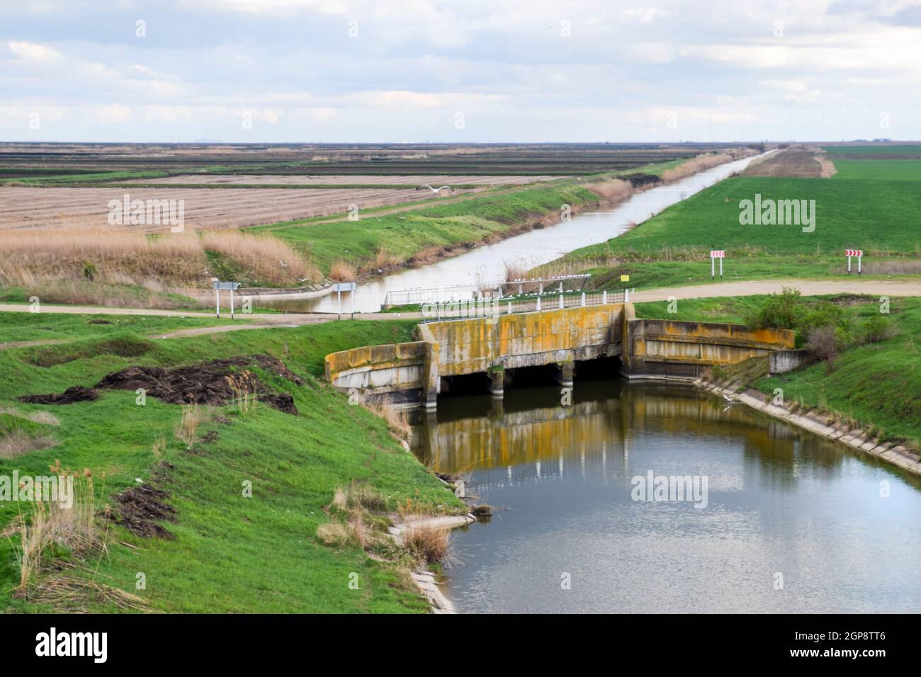 Bridges through irrigation canals. Rice field irrigation system Stock ...