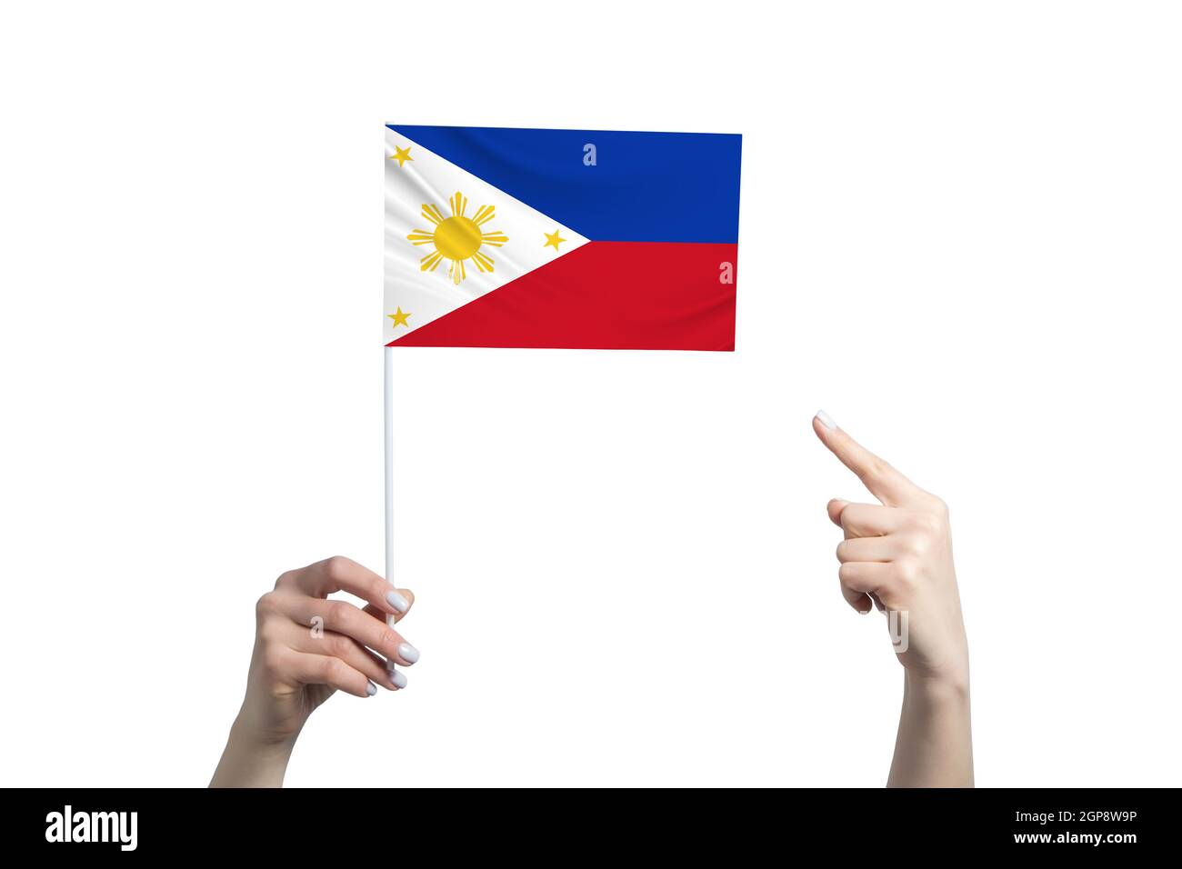 A beautiful female hand holds a Philippines flag to which she shows the ...