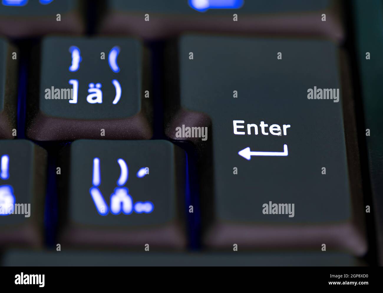 Closeup of laptop or desktop computer keyboard illumination, blue ...