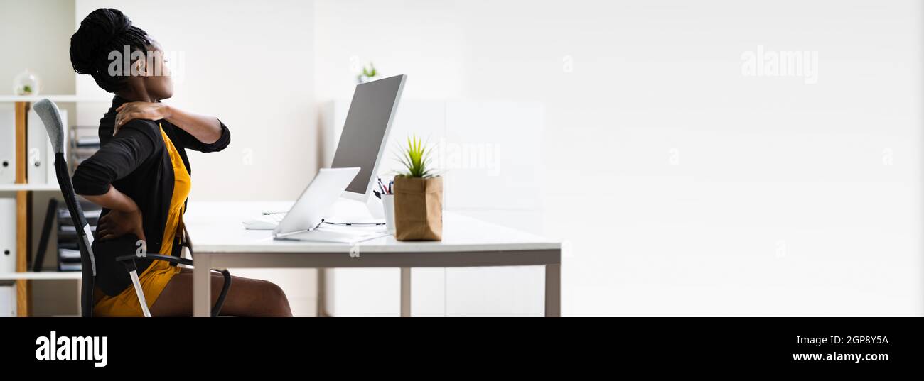 African Woman With Pain Back Bad Posture Problem In Chair Stock Photo ...