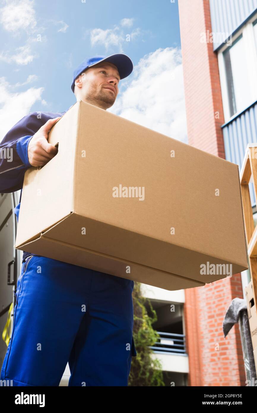 Delivery man loading up his vehicle hi-res stock photography and images ...