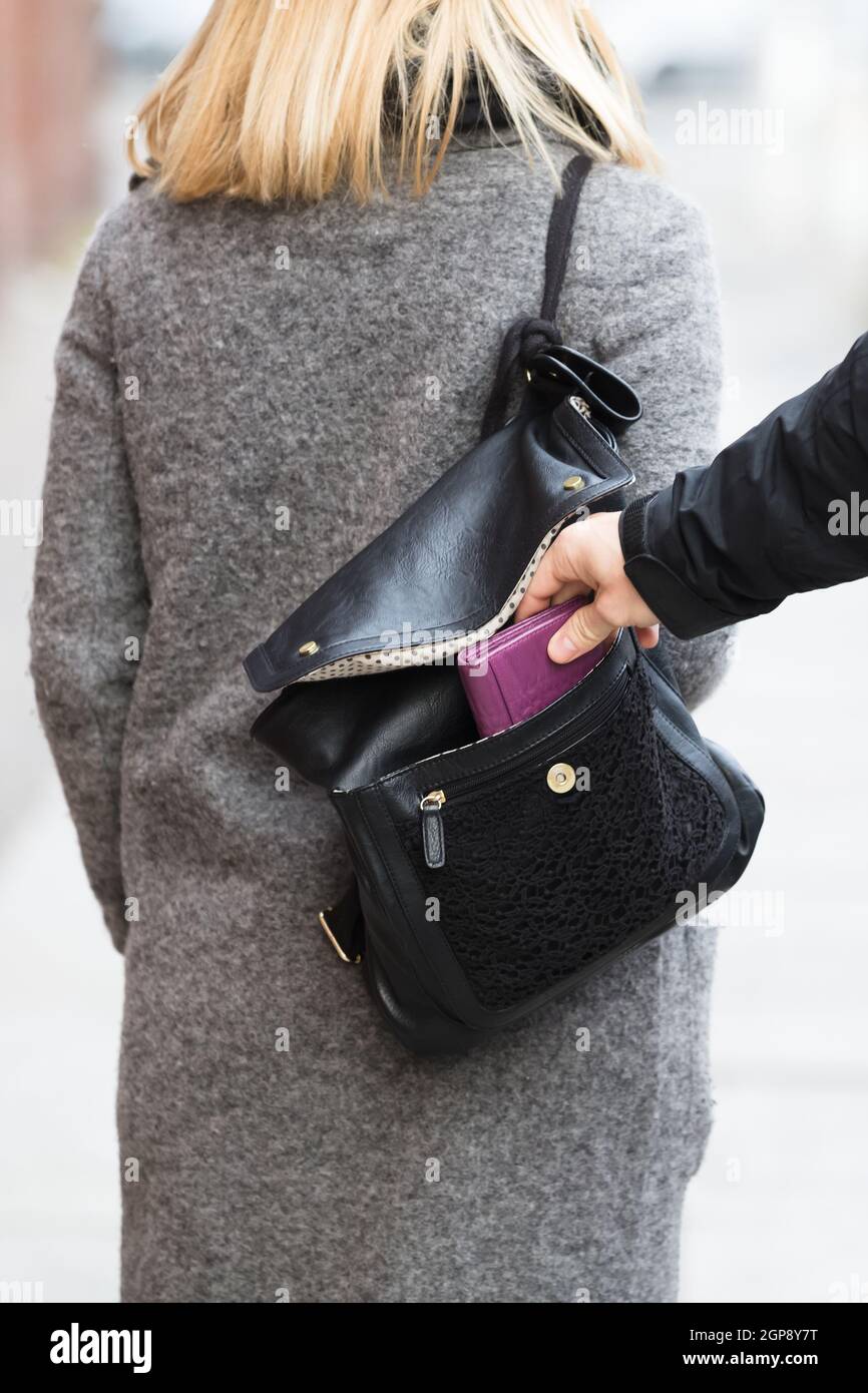 Thief Pickpocket Robbery. Wallet Pick From Pocket Stock Photo - Alamy