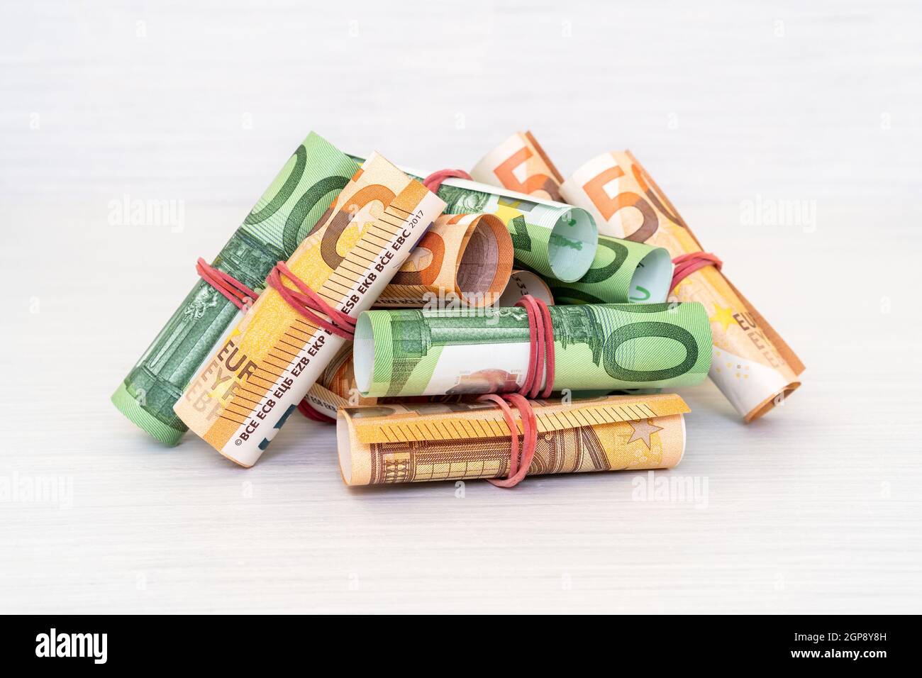 Pile of rolled up Euro banknotes Stock Photo - Alamy