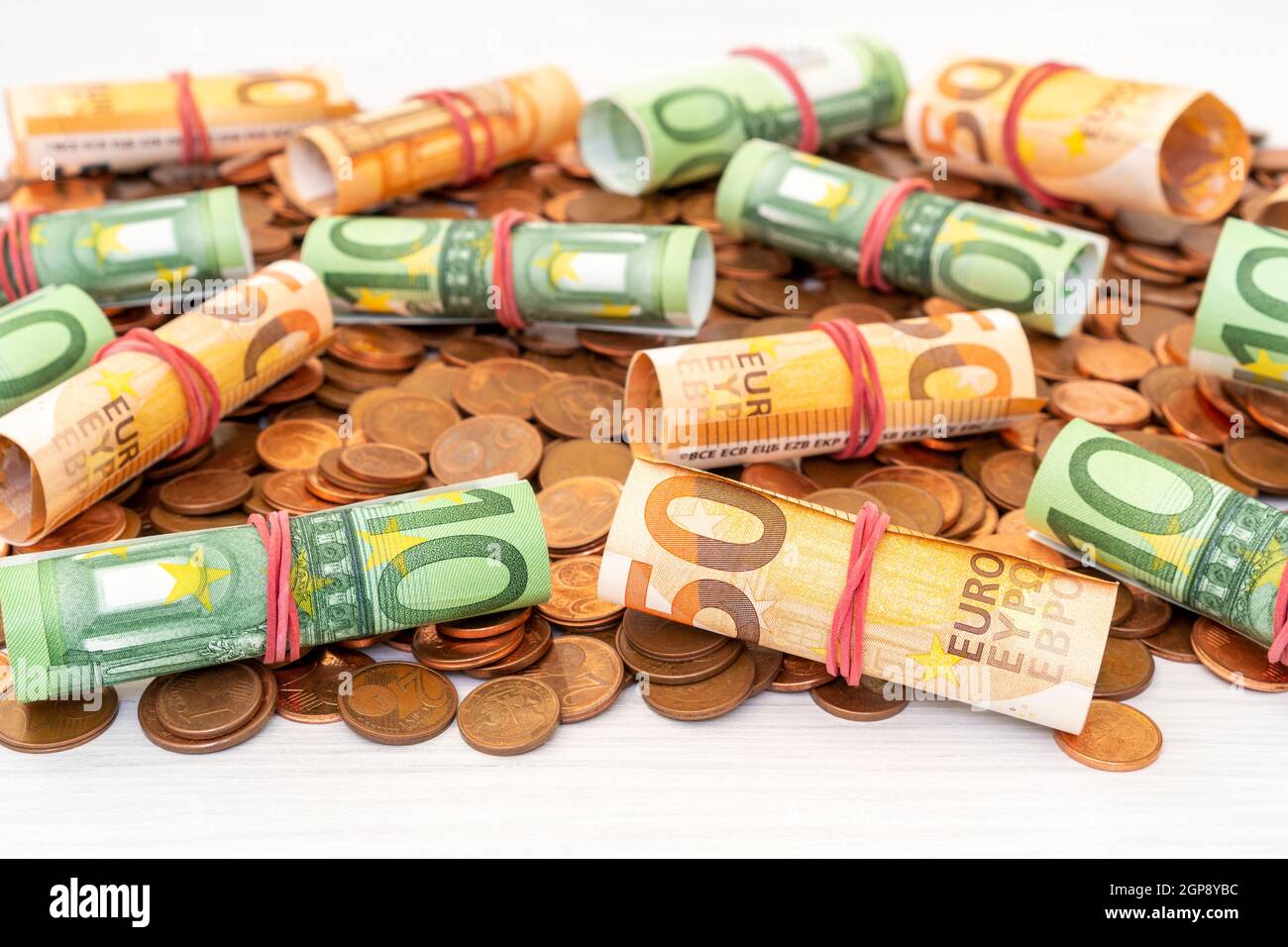 Rolls euro coins hi-res stock photography and images - Alamy