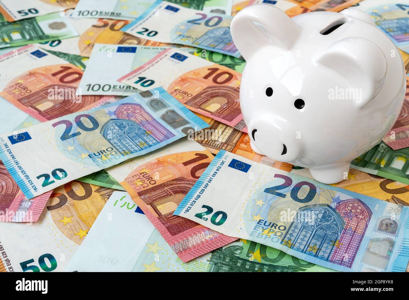 Piggy money box with euro cash close-up. Savings, finances and economy ...