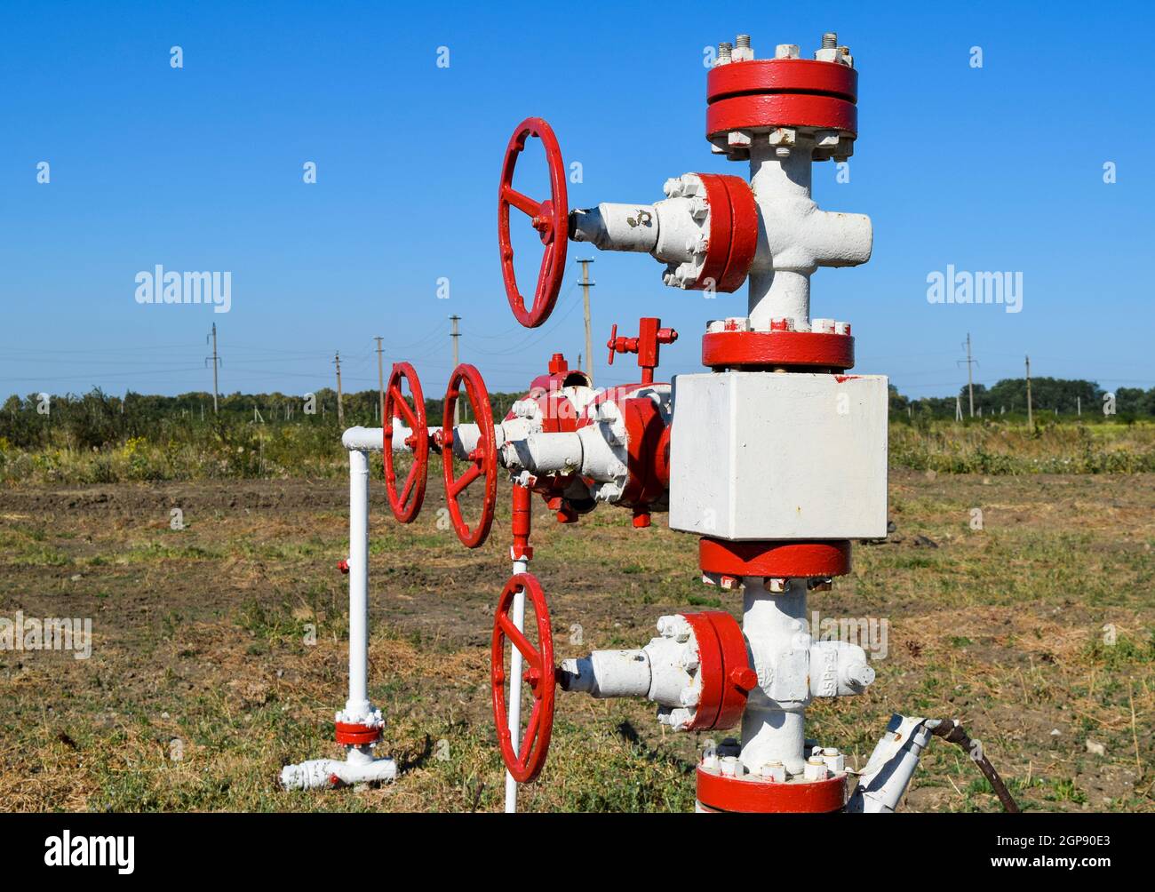 Well for oil and gas production. Oil well wellhead equipment. Oil production Stock Photo - Alamy