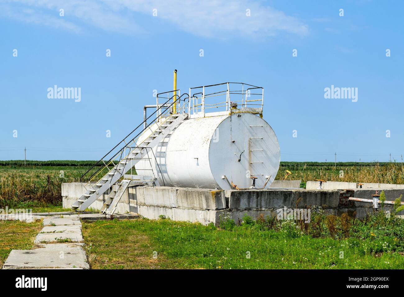 Reservoir for sludge of oil emulsion. Equipment at the oil field Stock ...