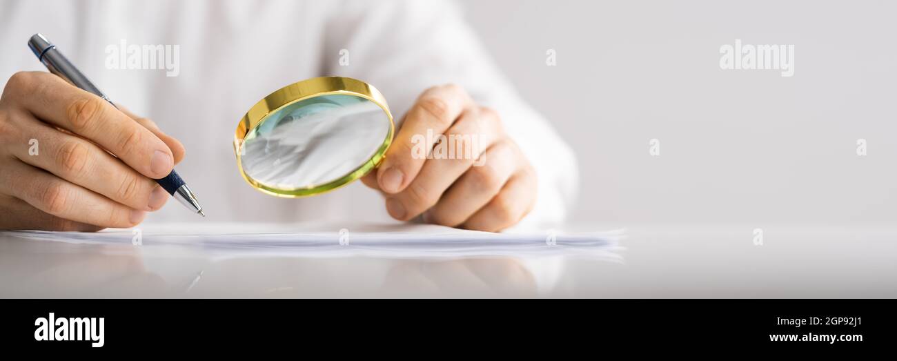 Fraud Investigation Through Magnifying Glass. Businessman Holding Loupe ...