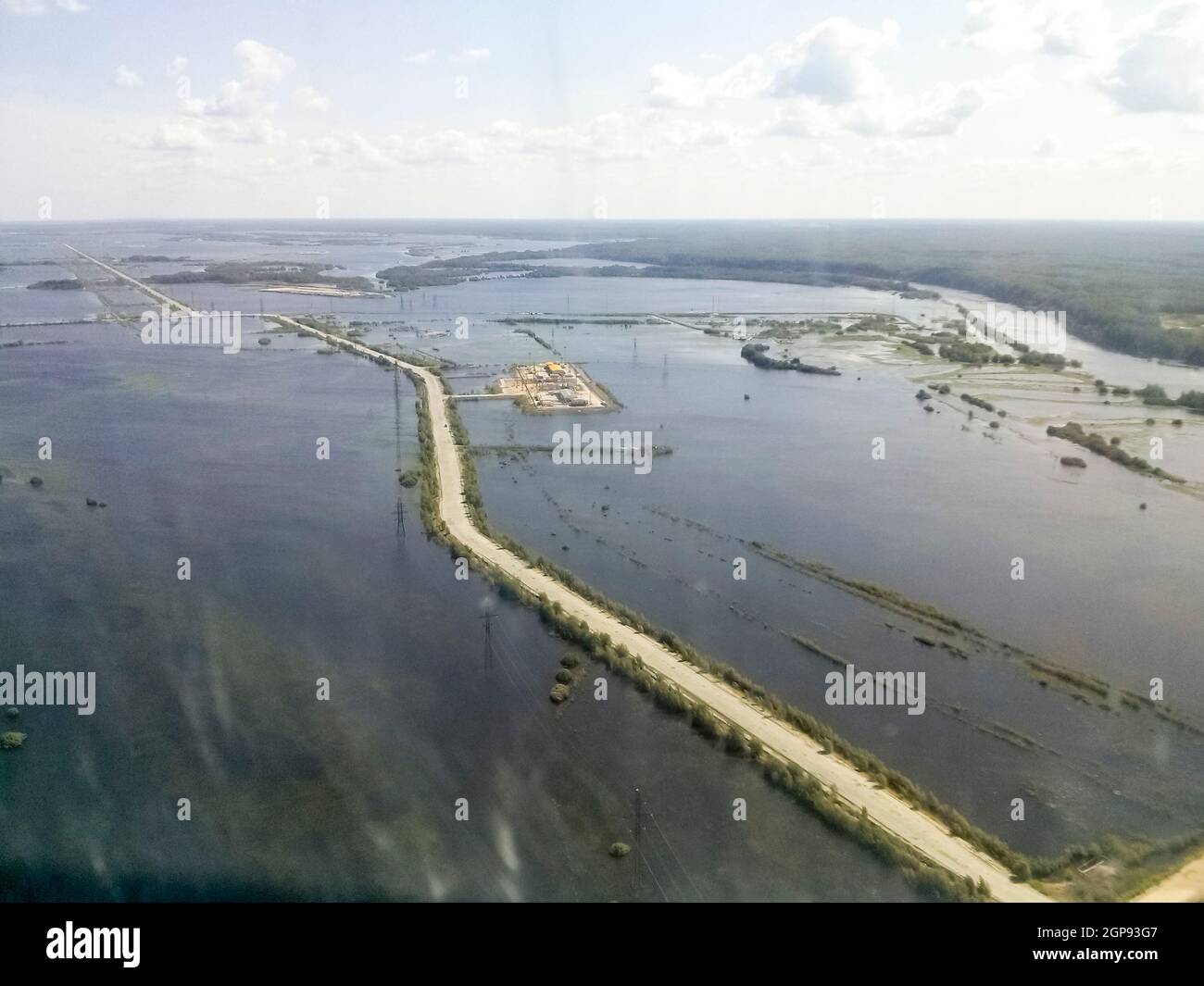 Top view of the oil and gas field. Wetlands and entrances to industrial ...