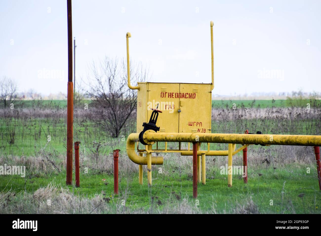 Gas distribution flap on the gas pipeline. Caption: Flammable - gas ...