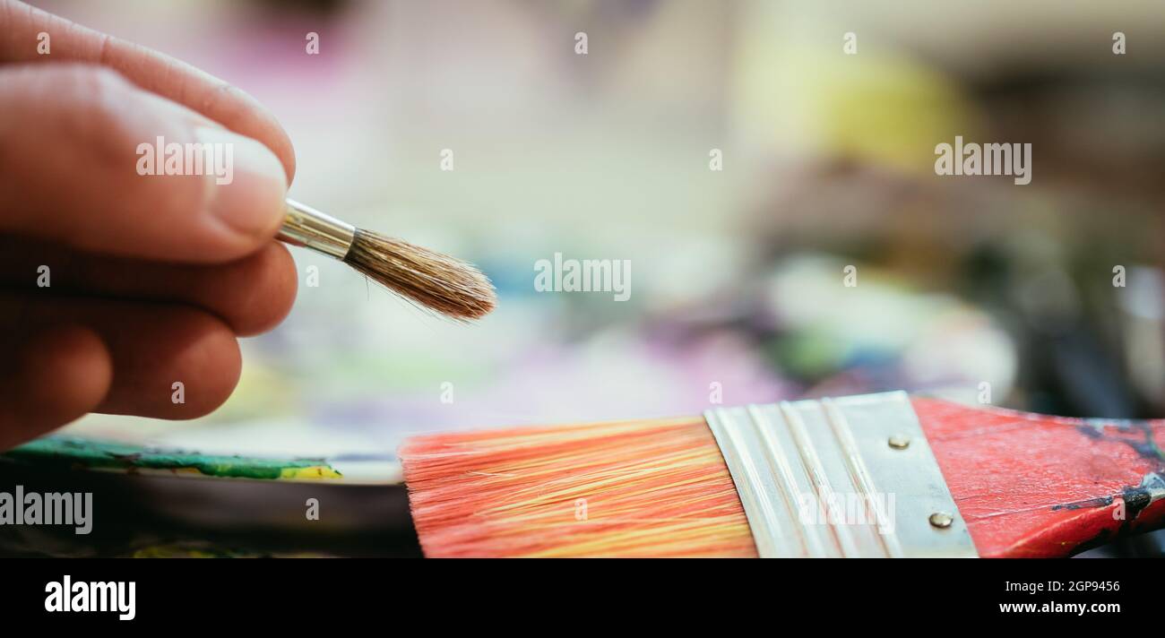 Artist paint brush on painting background. Painting therapy Stock Photo ...