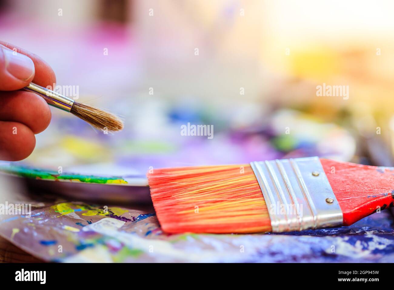 Artist paint brush on painting background. Painting therapy Stock Photo ...