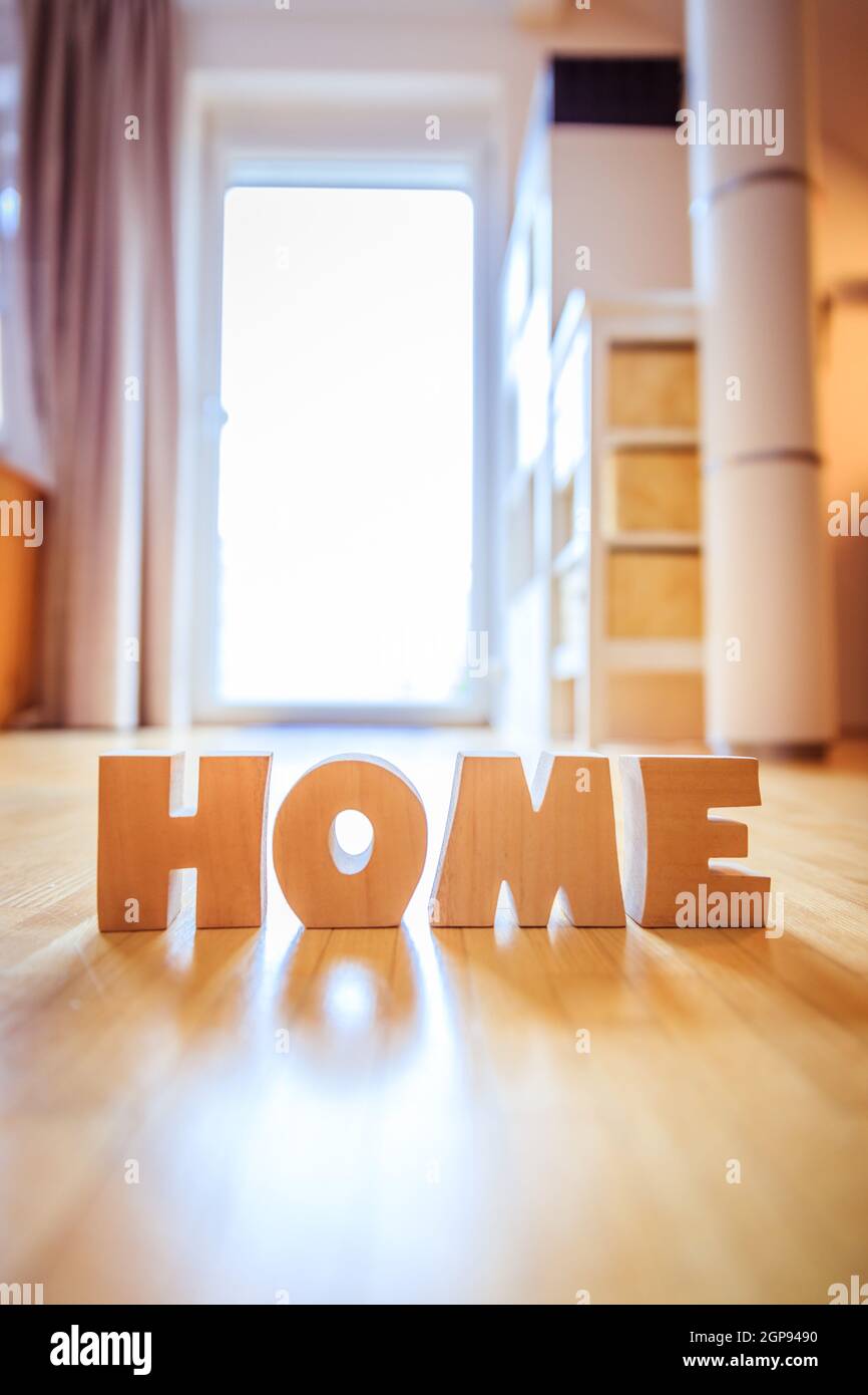Wooden HOME Letters on the floor of an apartment Stock Photo - Alamy