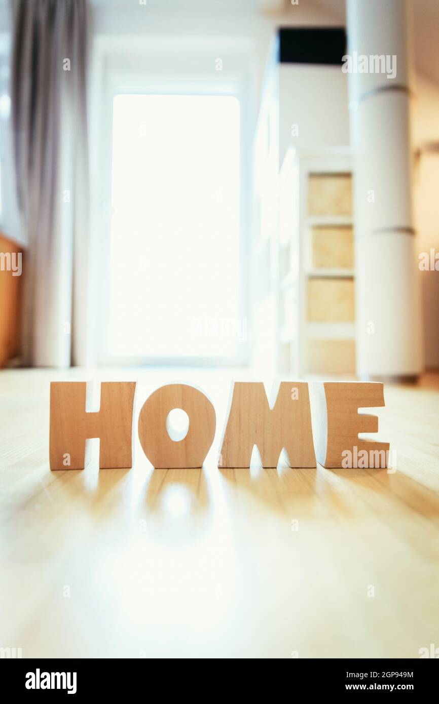 Wooden HOME Letters on the floor of an apartment Stock Photo - Alamy