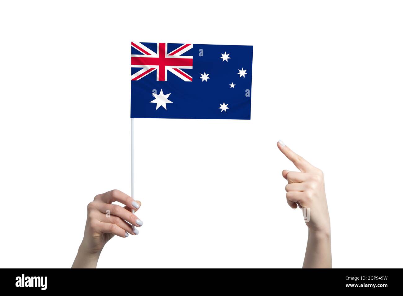 A beautiful female hand holds a Australia flag to which she shows the ...