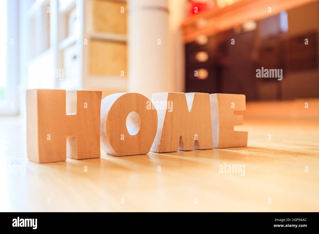 Wooden HOME Letters on the floor of an apartment Stock Photo - Alamy