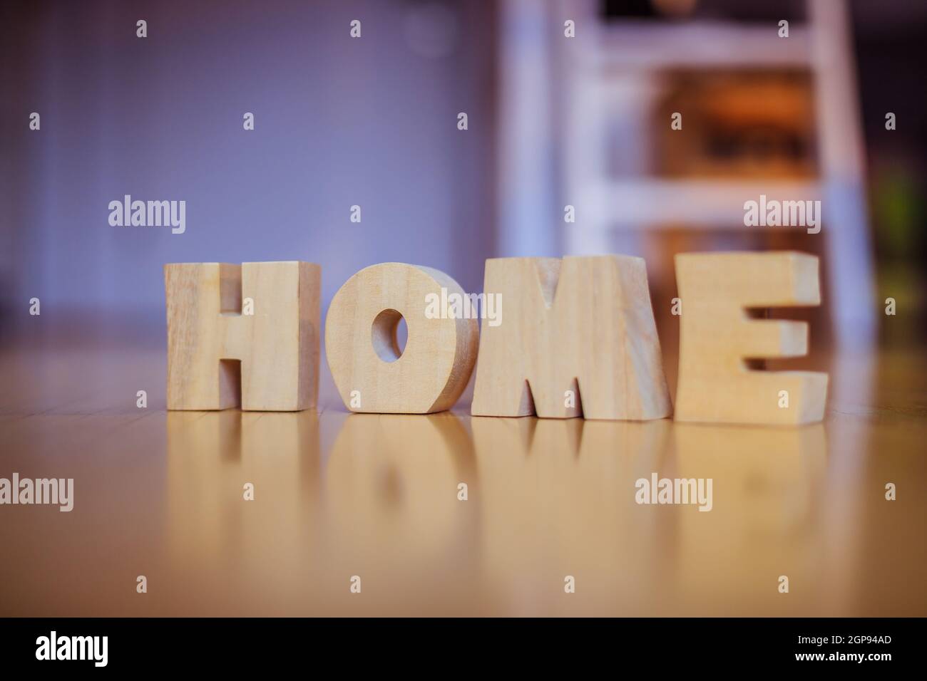 Wooden HOME Letters on the floor of an apartment Stock Photo - Alamy