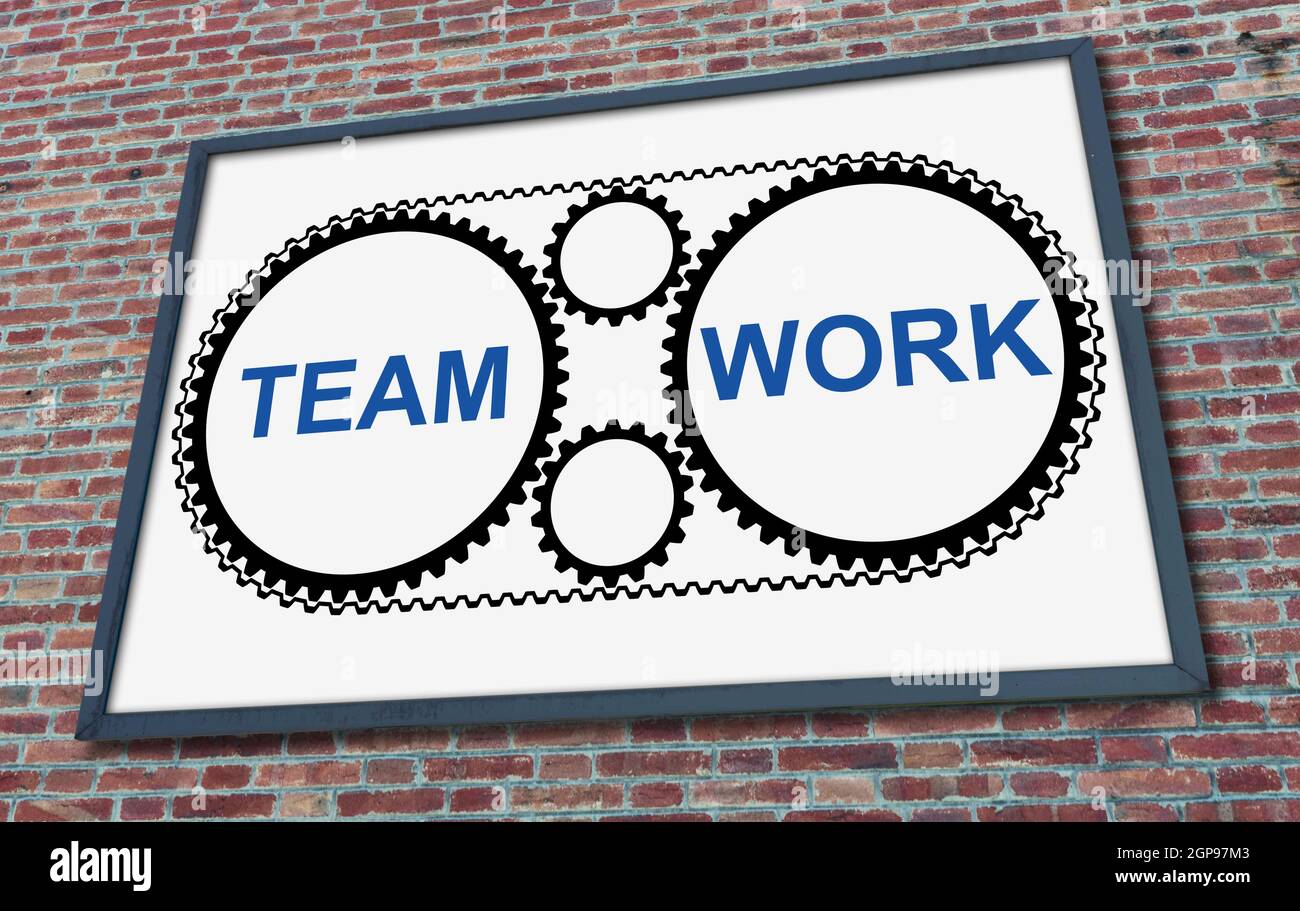Teamwork concept drawn on a billboard fixed on a brick wall Stock Photo ...