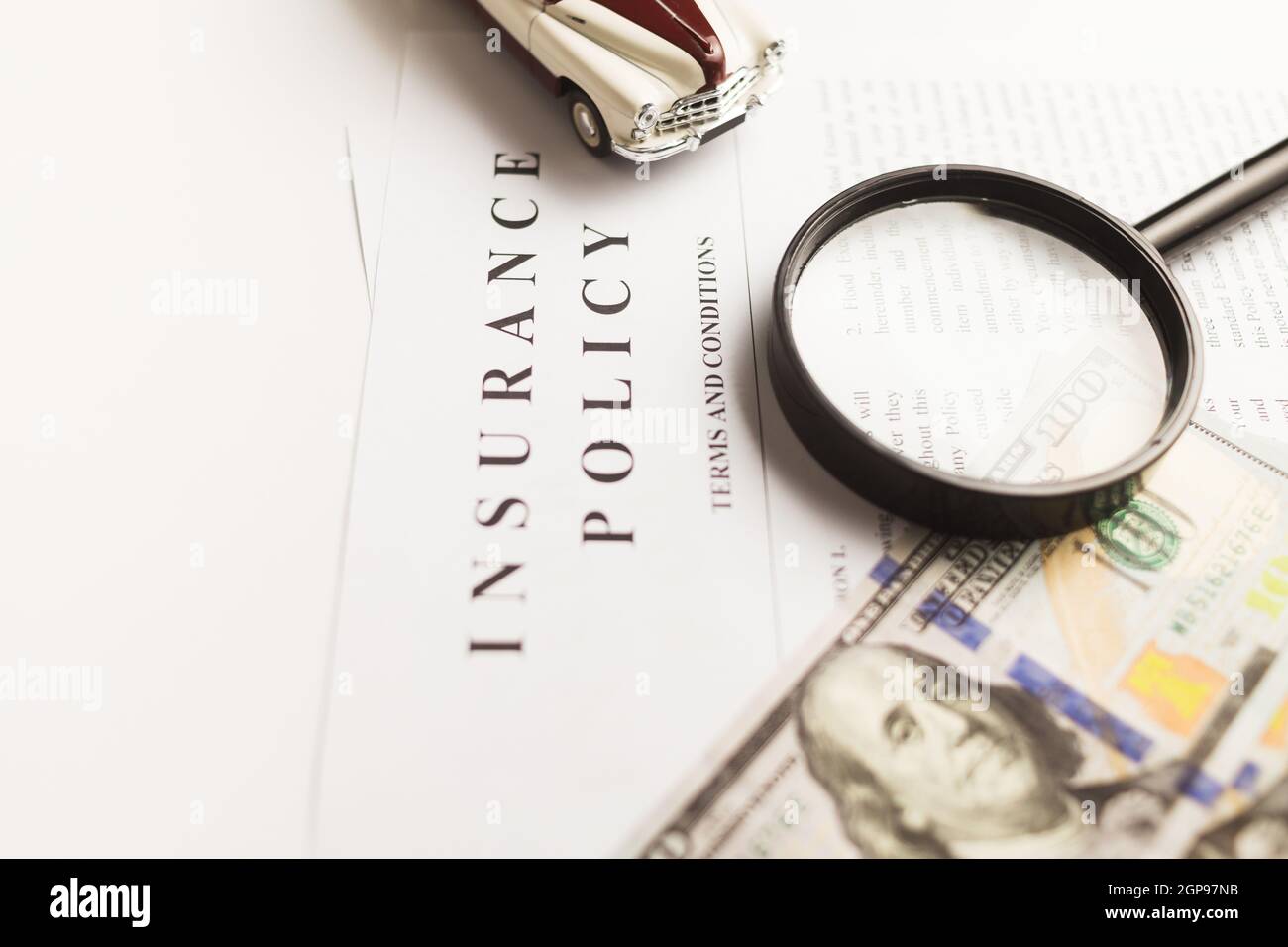 Certificate Of Motor Insurance And Policy With Car And Dollar Bills certificate-of-motor-insurance-and-policy-with-car-and-dollar-bills