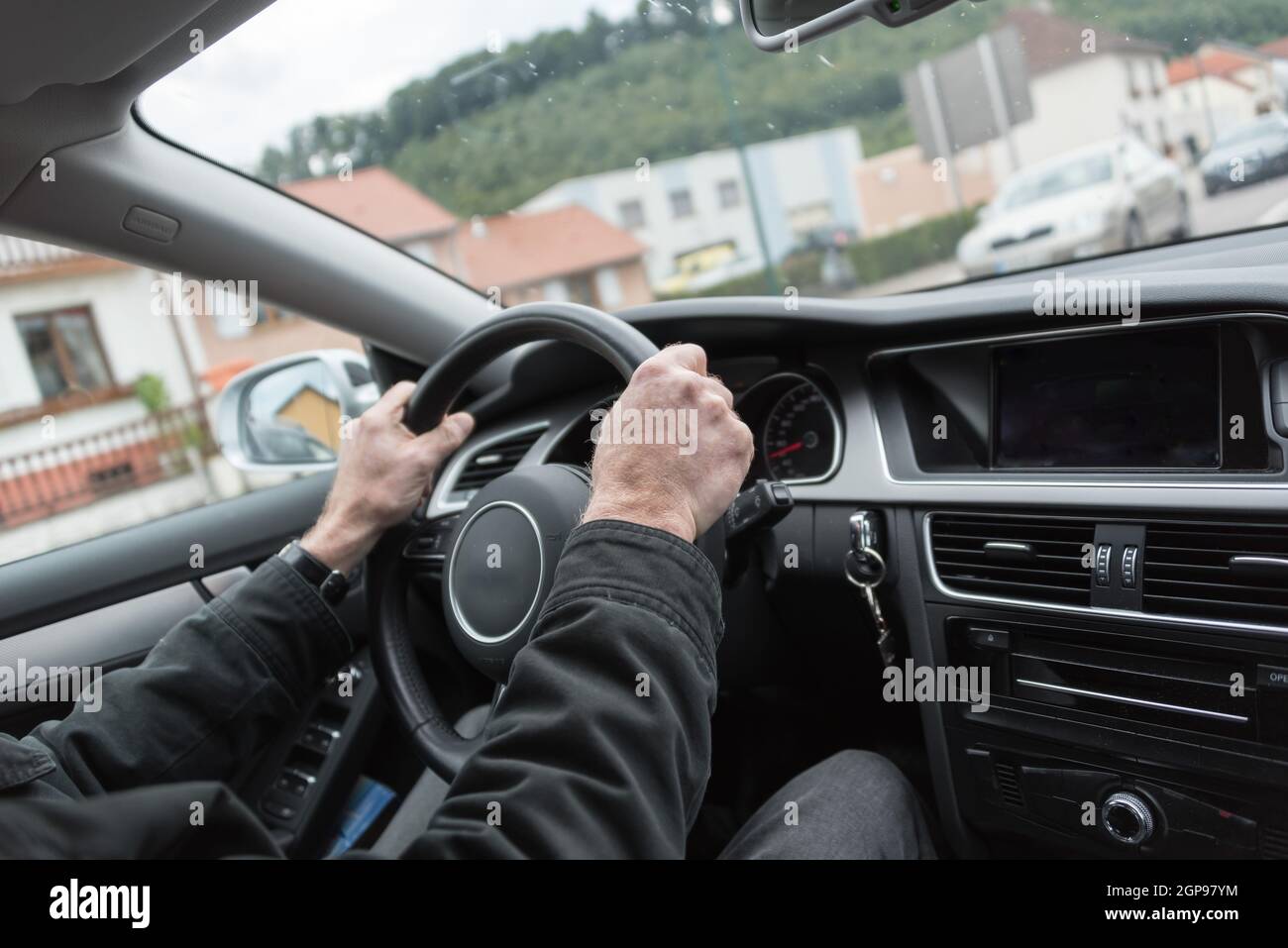 Car driving with both hands on the wheel Stock Photo - Alamy