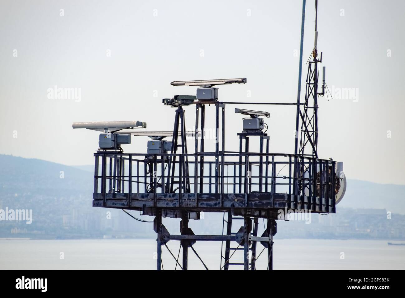 Rotating antennas of a military radio station on a tower Stock Photo ...
