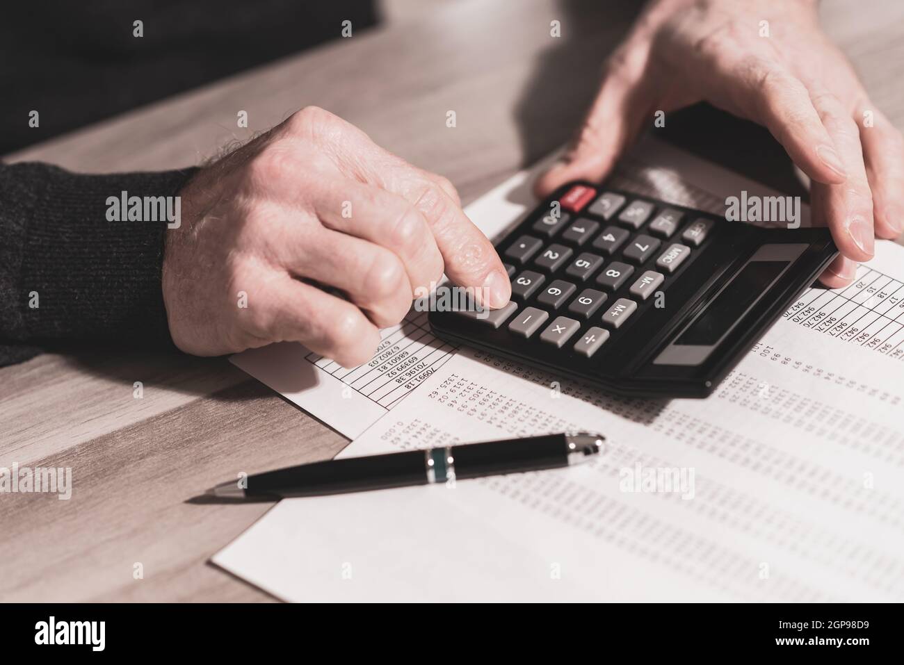 Male hand using calculator, accounting concept Stock Photo - Alamy