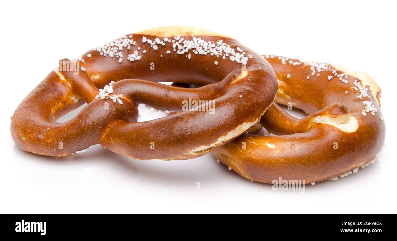 Two bretzel, isolated on white Stock Photo - Alamy
