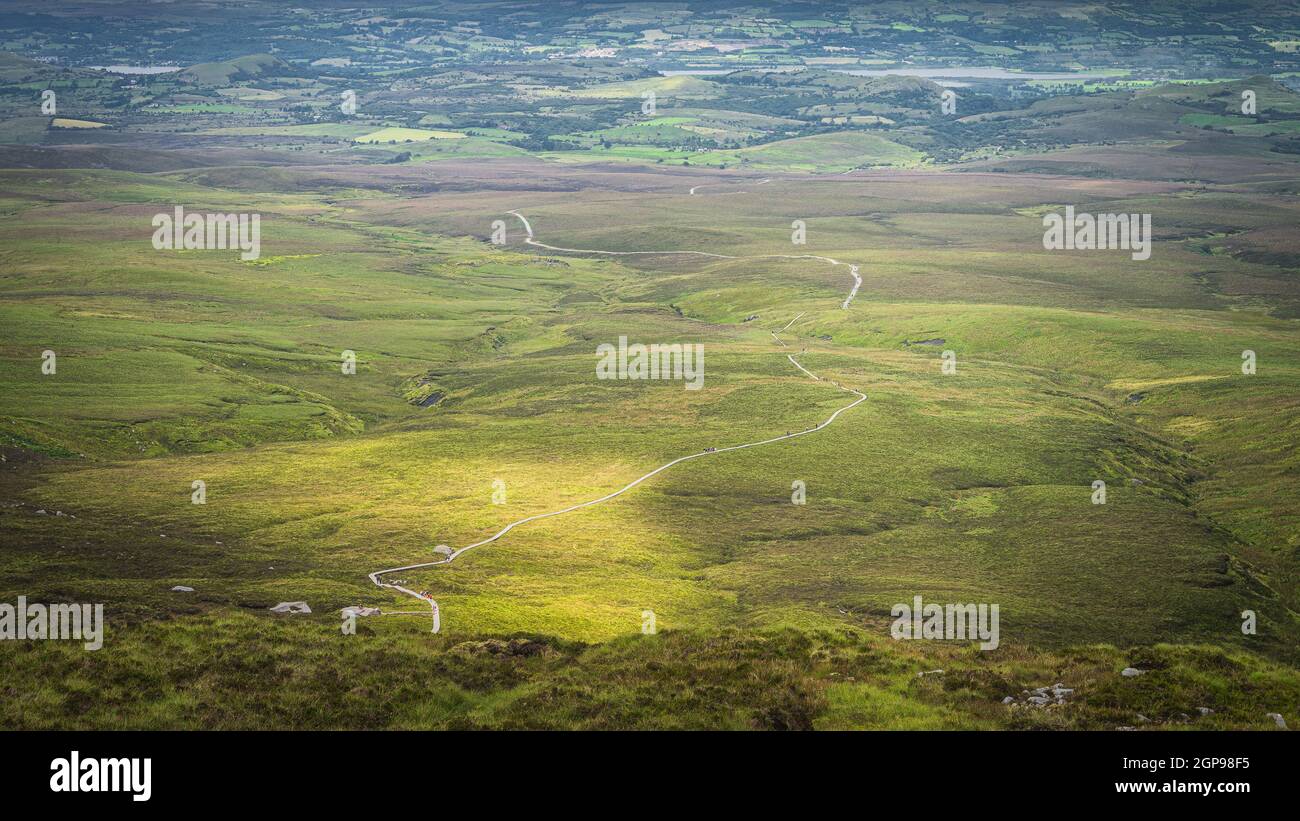 View from the mountain peak on winding wooden path of Cuilcagh Park ...