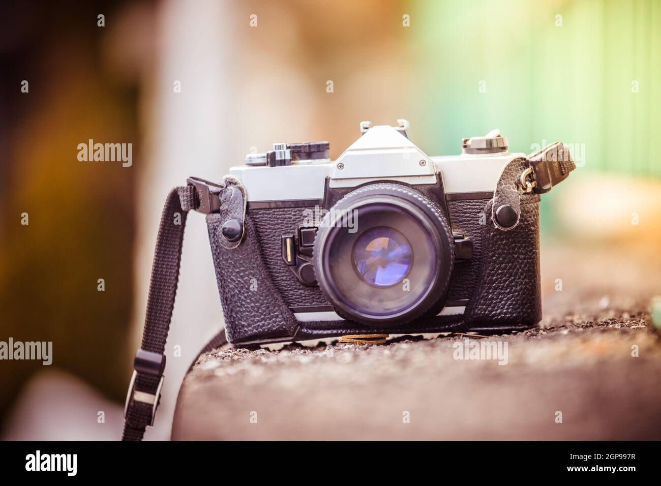 Retro vintage photography camera on a stony wall, outdoors Stock Photo ...