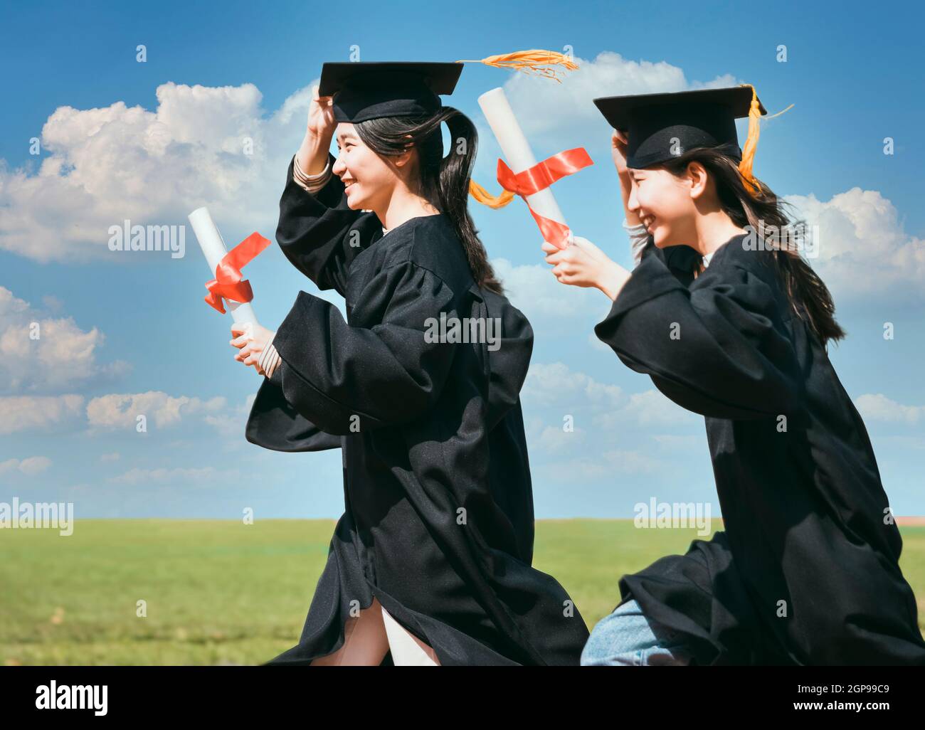 Group of Students Celebrating Graduation and running on the track Stock ...