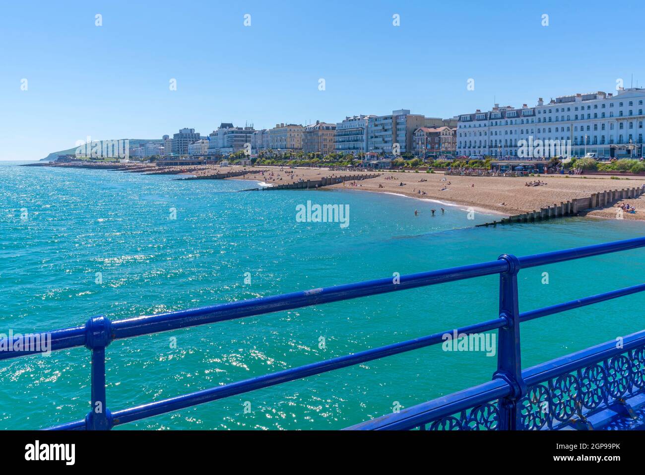 View of beach and sea front hotels from Eastbourne pier in summer time ...