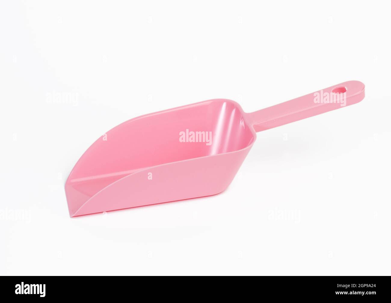 plastic kitchen scoop for bulk products on white background, close up ...