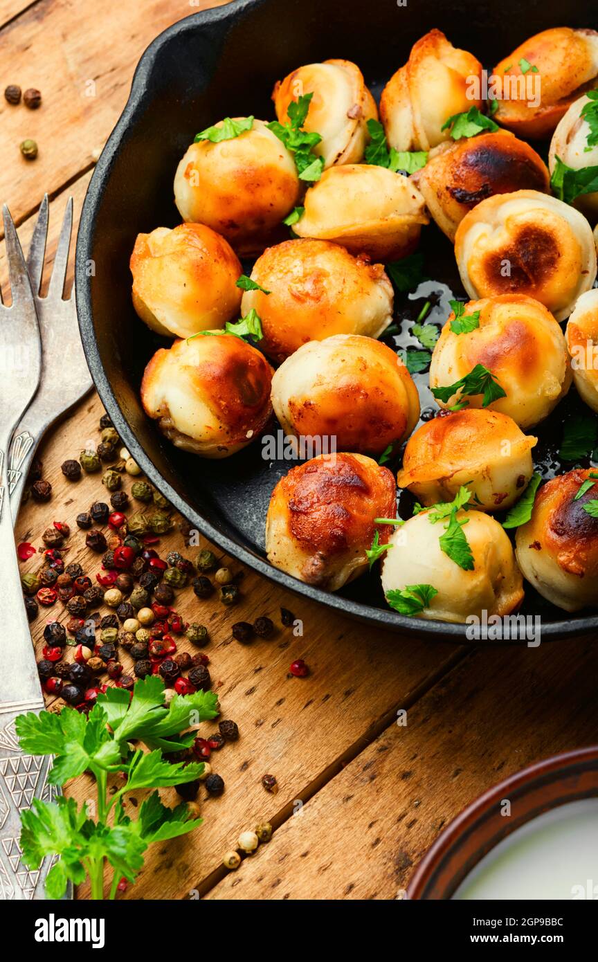 Frying pan with roasted tasty pelmeni.Fried dumplings Stock Photo - Alamy