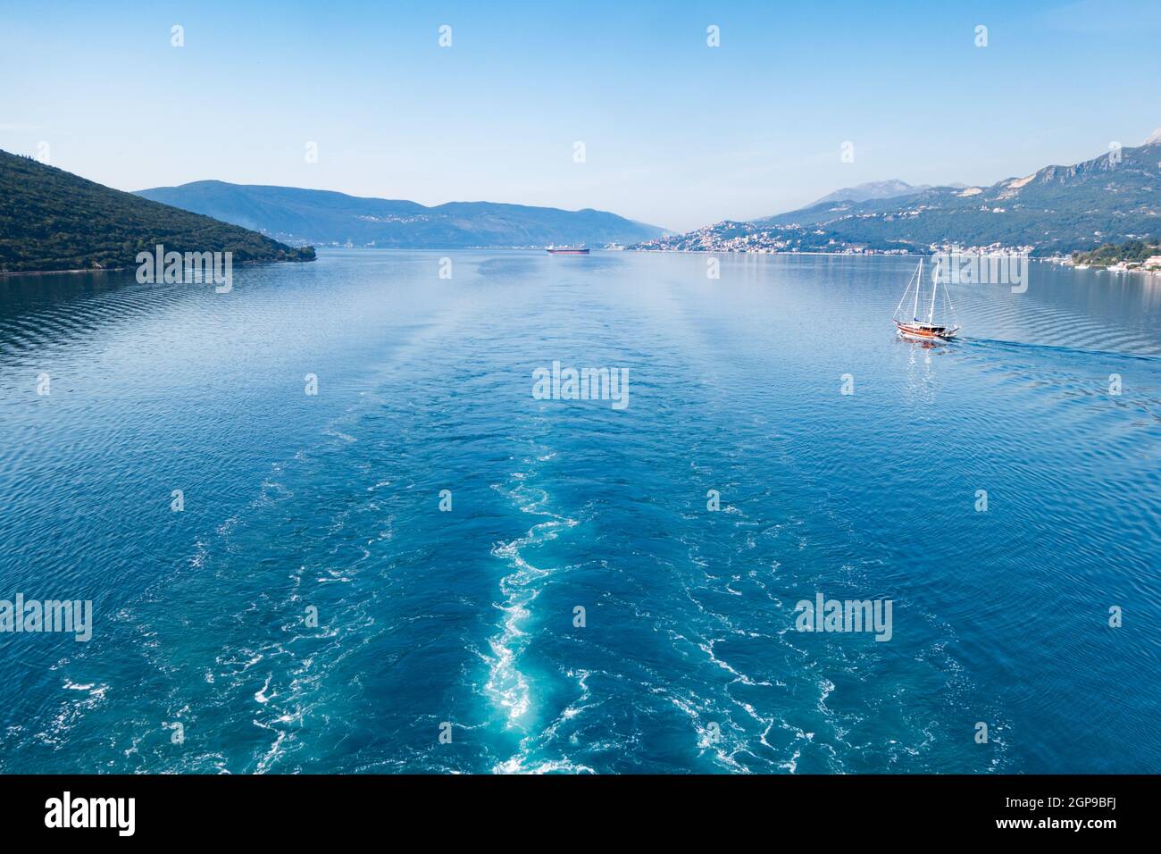 View of Bay of Kotor from the sea surrounded by mountains in Montenegro ...