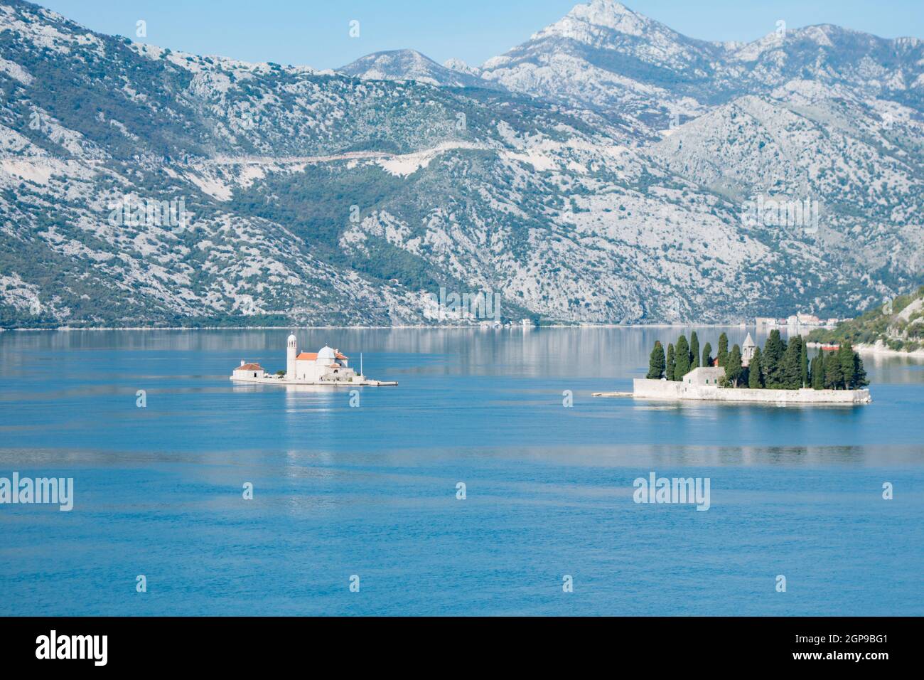 View over the bay of Kotor surrounded by mountains with the town of ...
