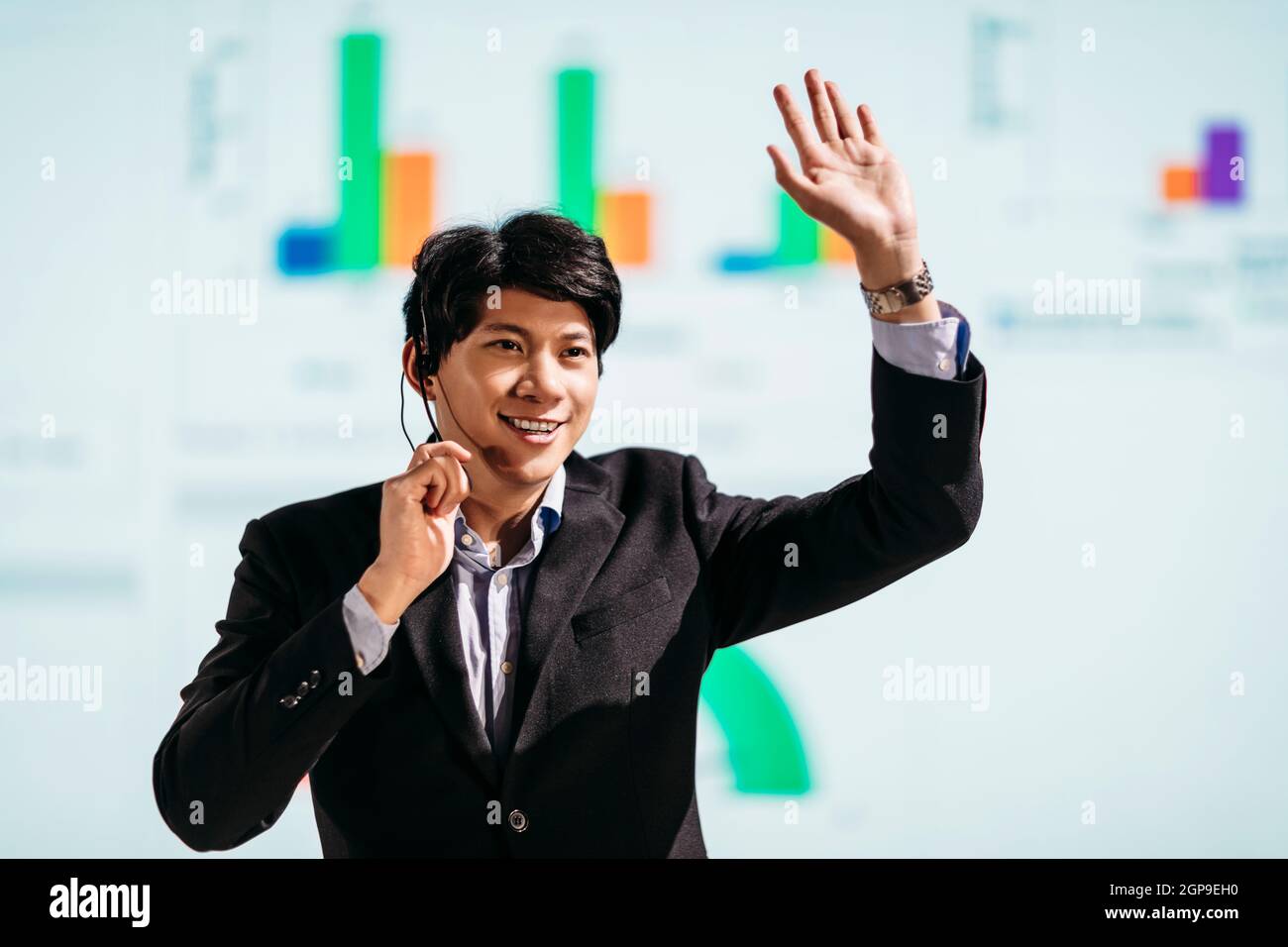 Male Asian Speaker Stands on Stage for Business Presentation Stock ...