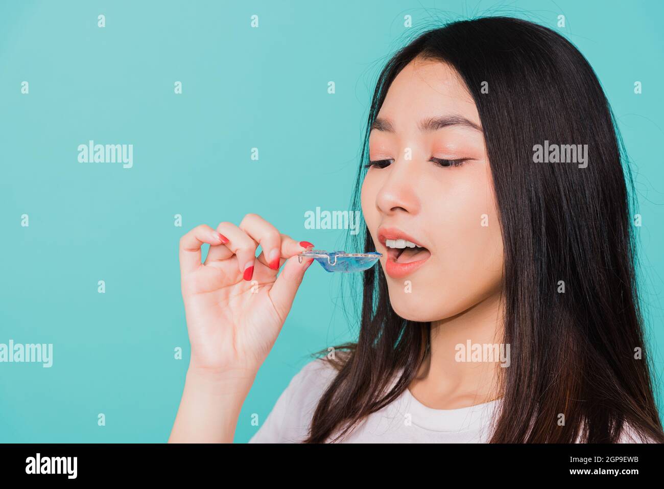 Female hold teeth retaining tools after removable braces, Portrait ...