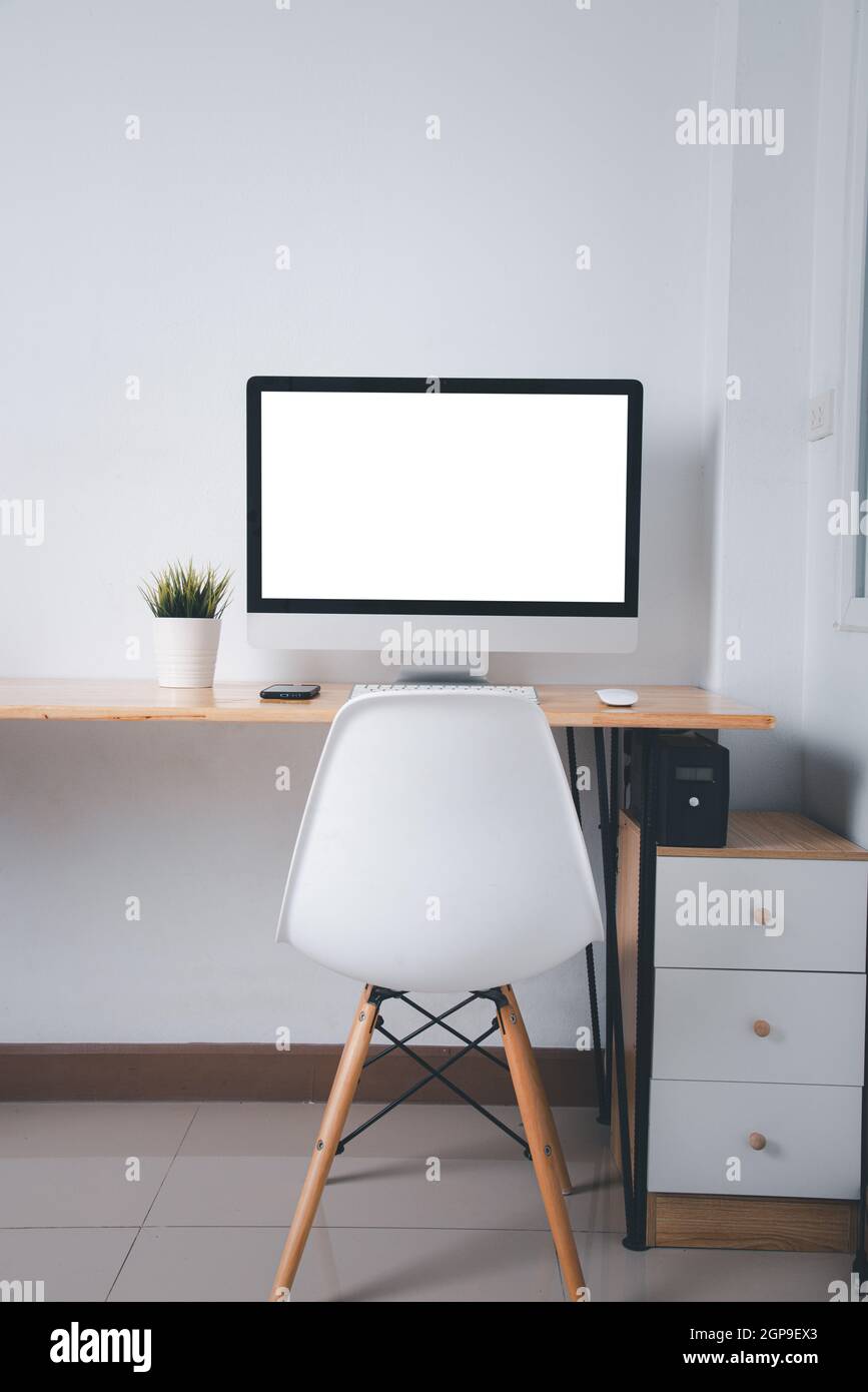 Computer monitor with white blank screen on the business desk with ...