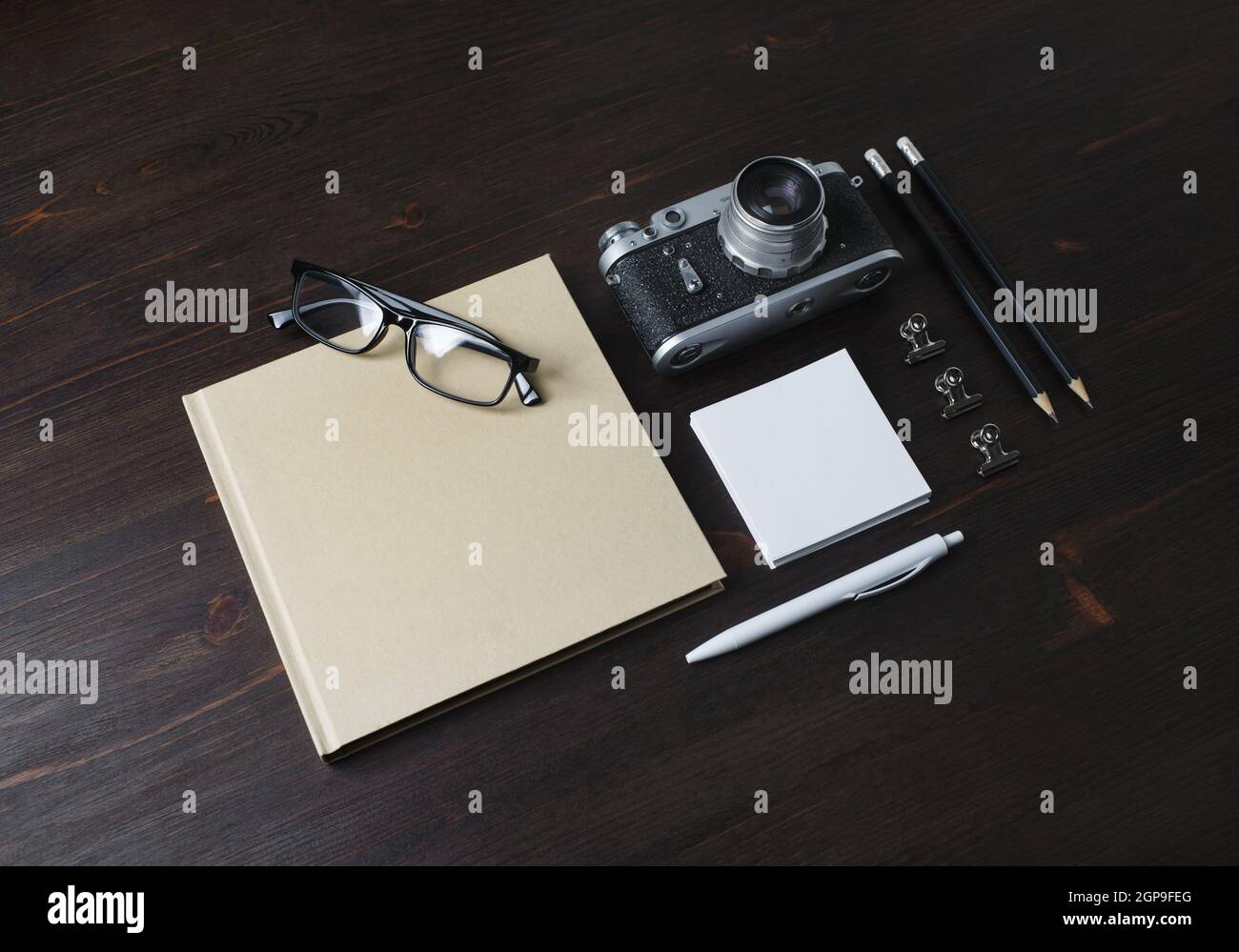 Blank stationery and vintage camera on wood table background Stock ...