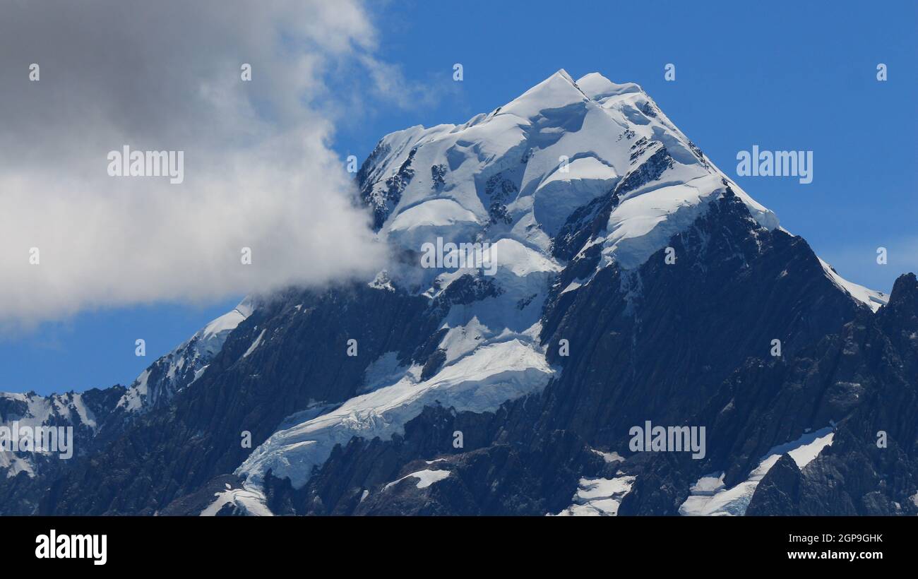 Glacier on top of Mount Cook and cloud Stock Photo - Alamy