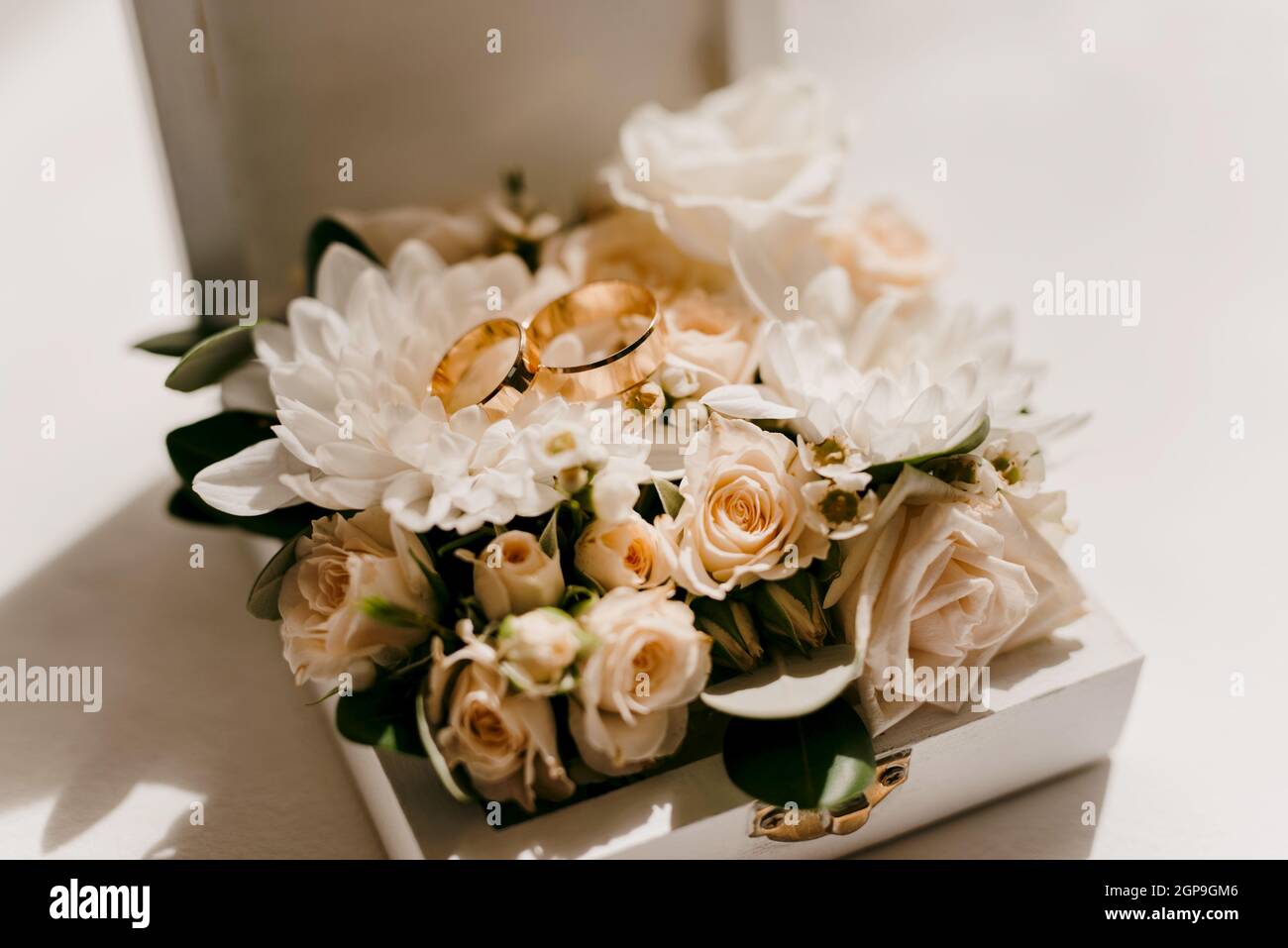 wedding rings with a wedding decor Stock Photo - Alamy
