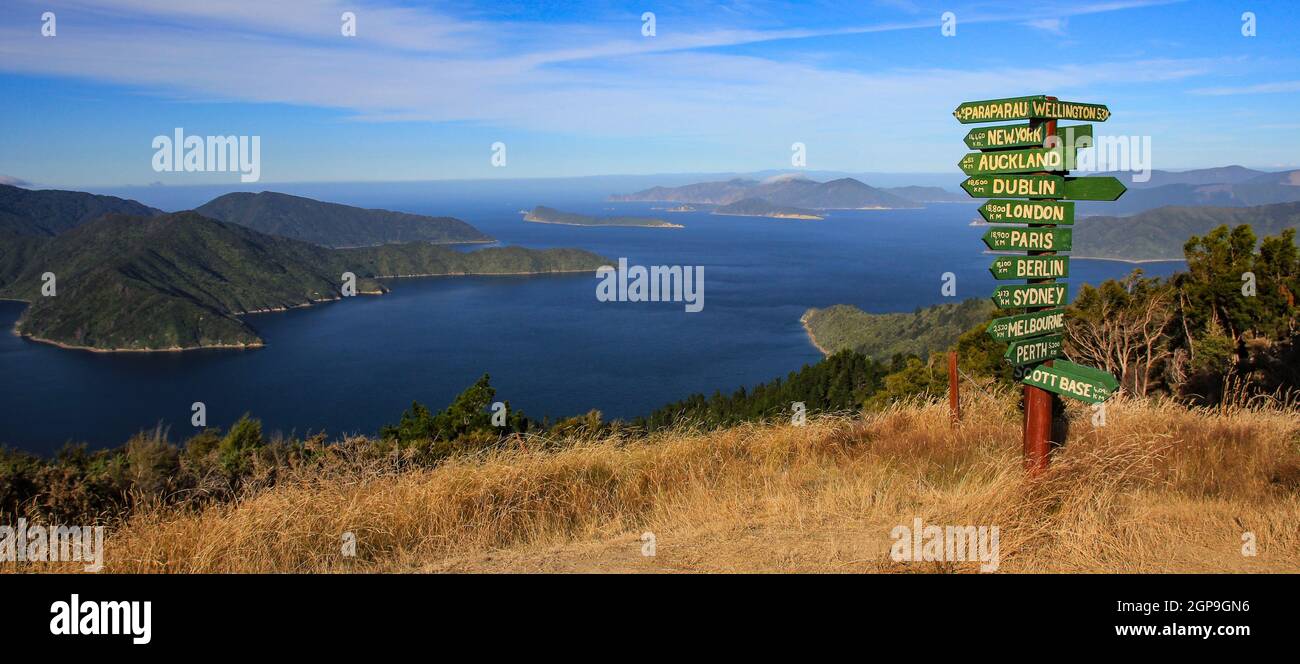 International directional signs and Queen Charlotte Sound, New Zealand ...