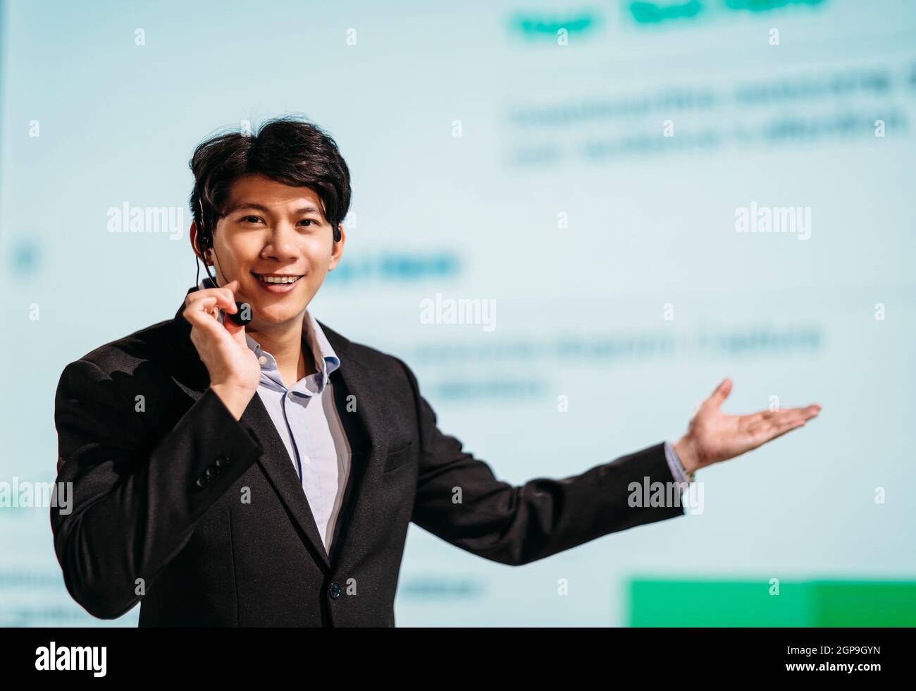 Male Asian Speaker Stands on Stage for Business Presentation Stock ...