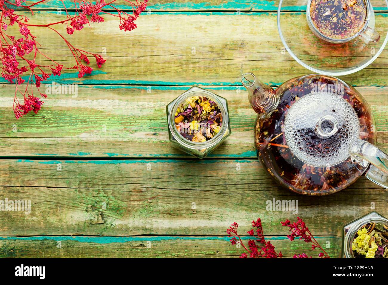 Fragrant flower tea in a glass teapot.Space for text Stock Photo - Alamy