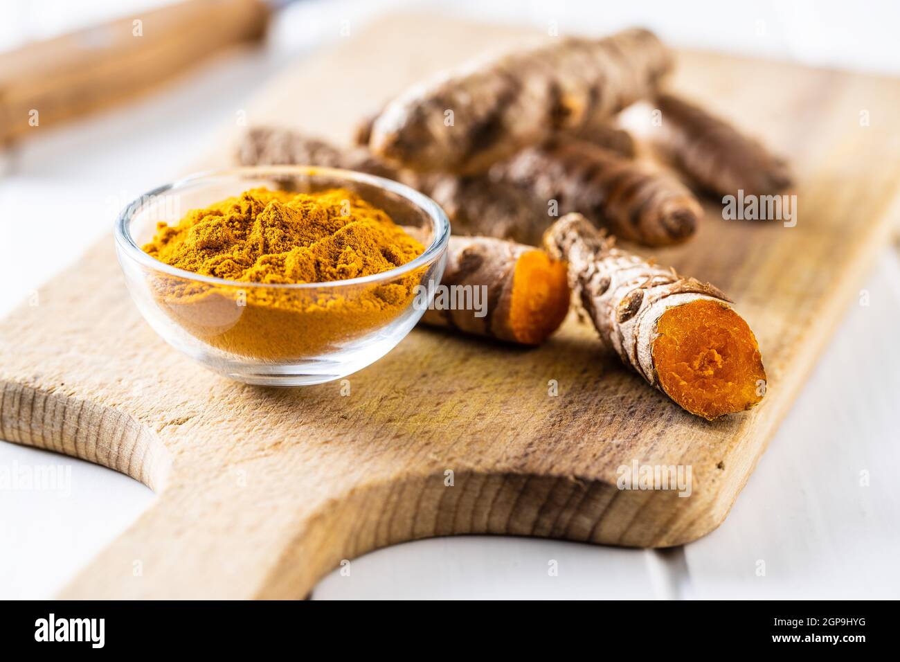 Indian turmeric powder and root. Turmeric spice. Ground turmeric in ...