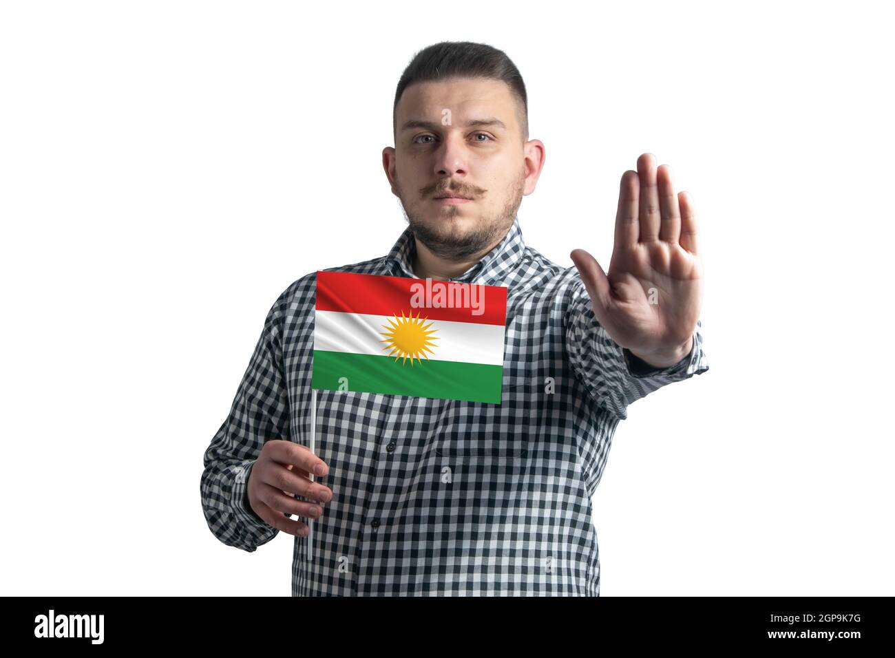 White guy holding a flag of Kurdistan and with a serious face shows a ...